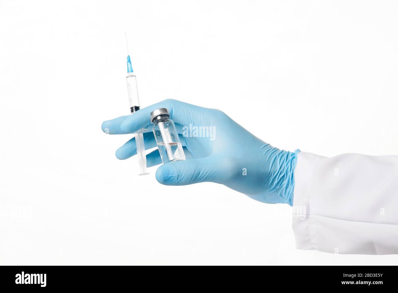 Close up hand of doctor in blue latex glove with glass ampoule and ...