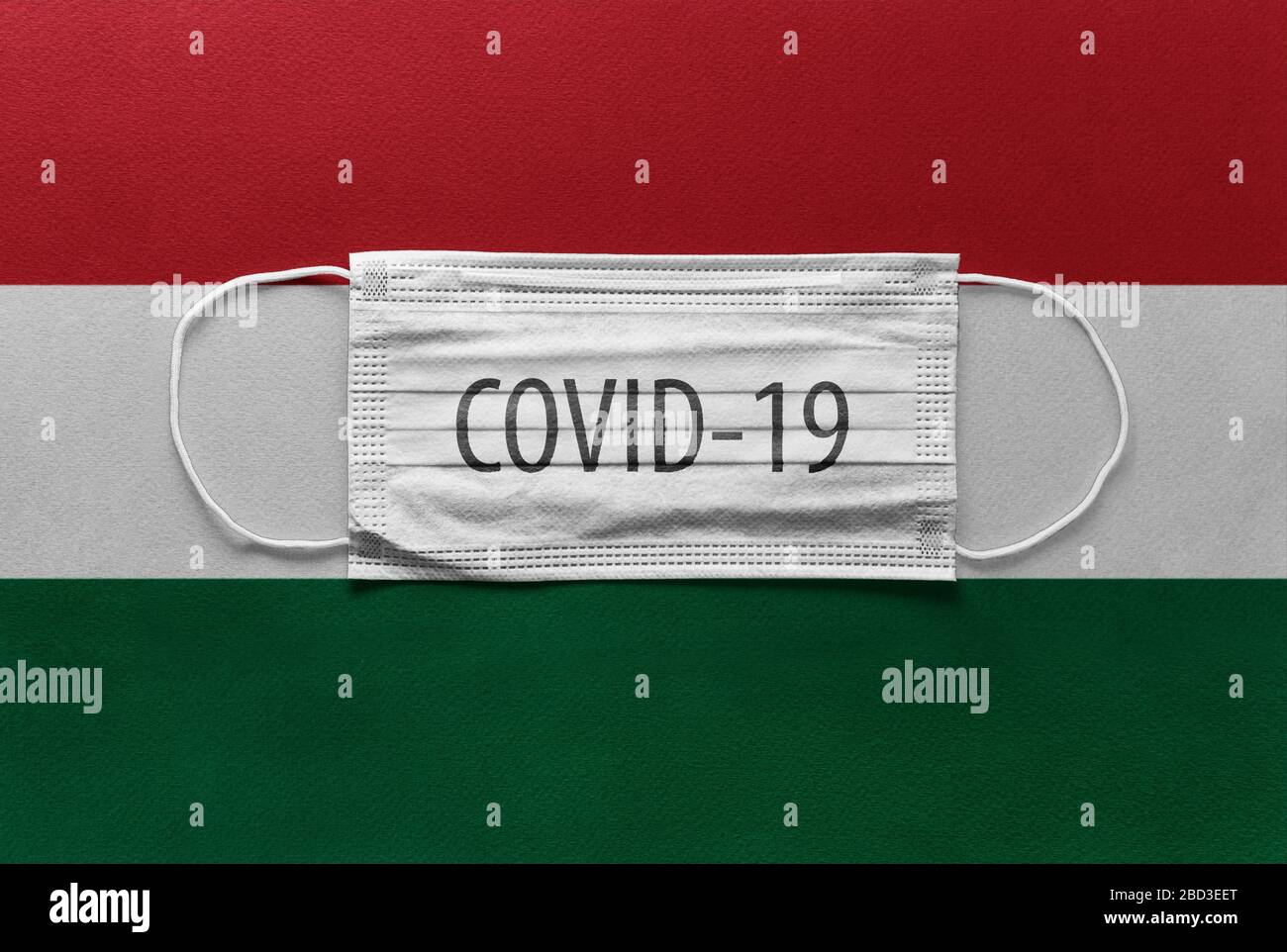 An individual face medical surgical mask on Hungary national flag ...