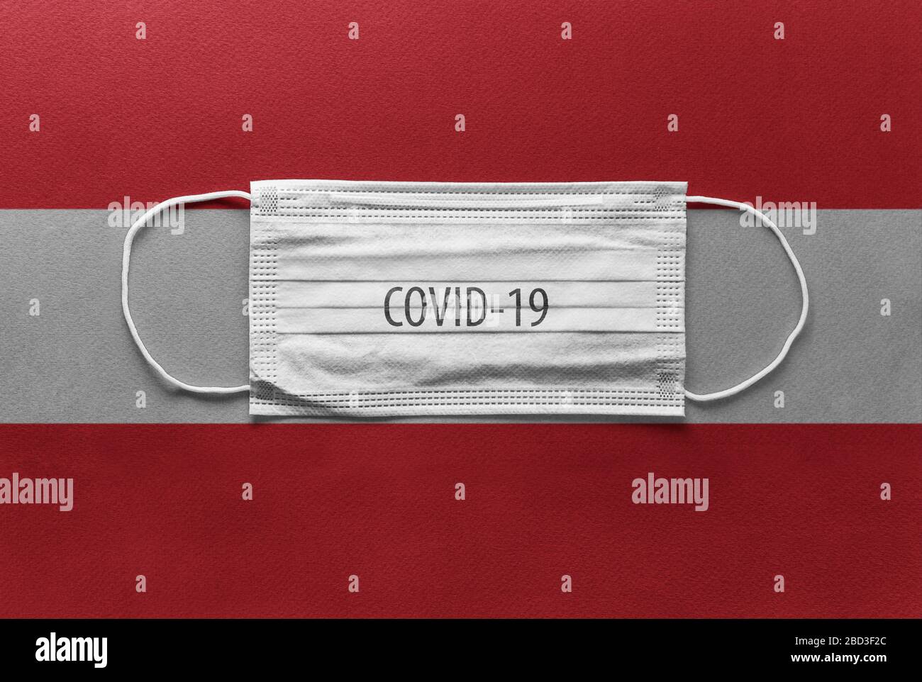 An individual face medical surgical mask on Austria national flag ...