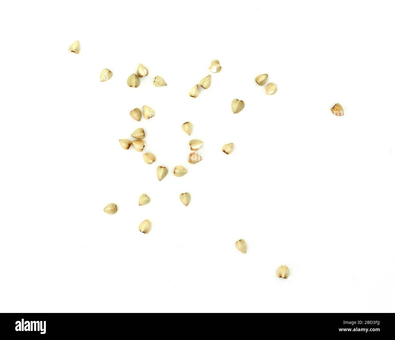 Pile of buckwheat grain isolated on white background close up. Ancooked ...