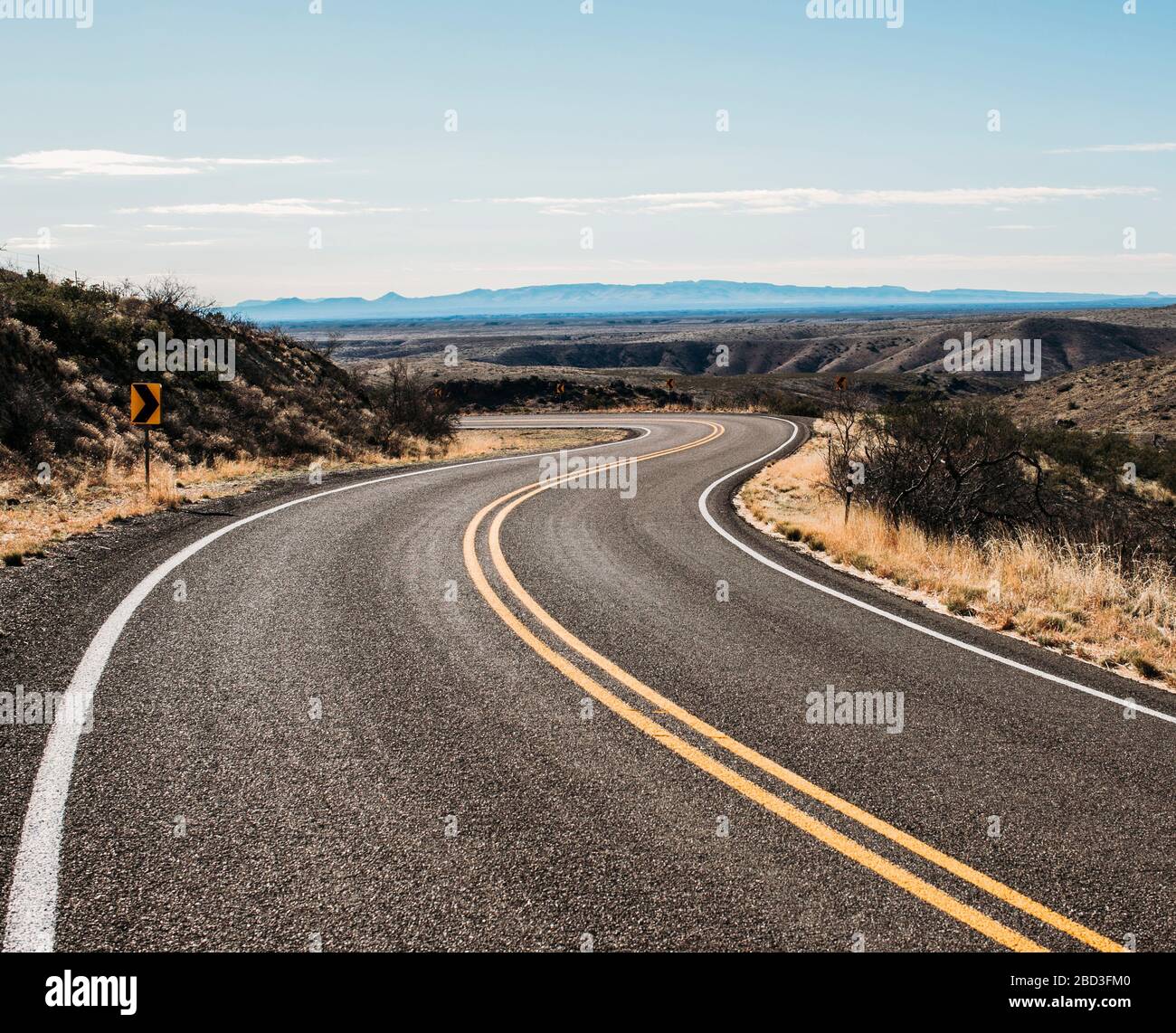 a deserted road winds through the desert near Arrey, New Mexico Stock ...