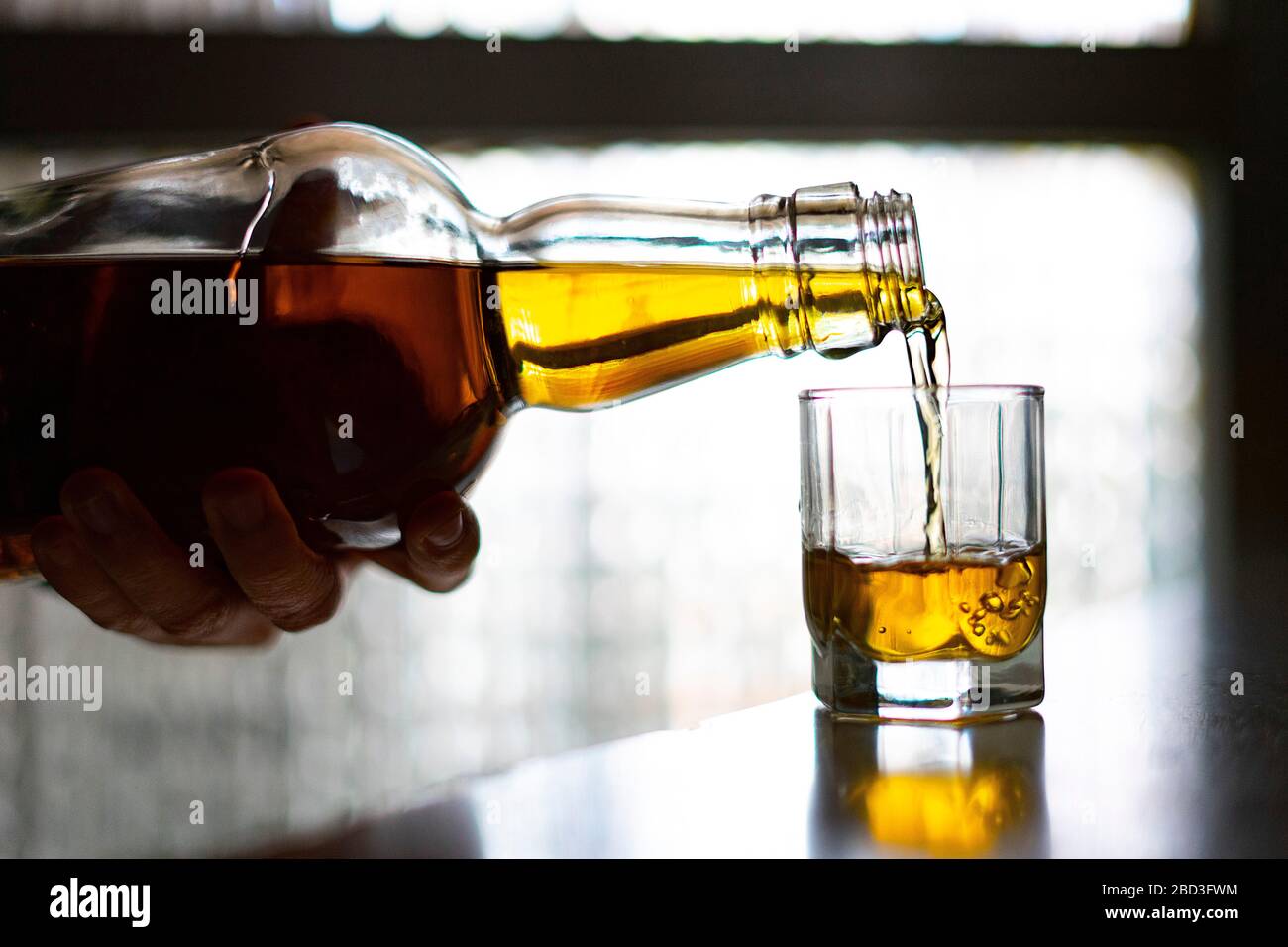 Barman serving a shot of whiskey. Bartender and whiskey concept Stock ...
