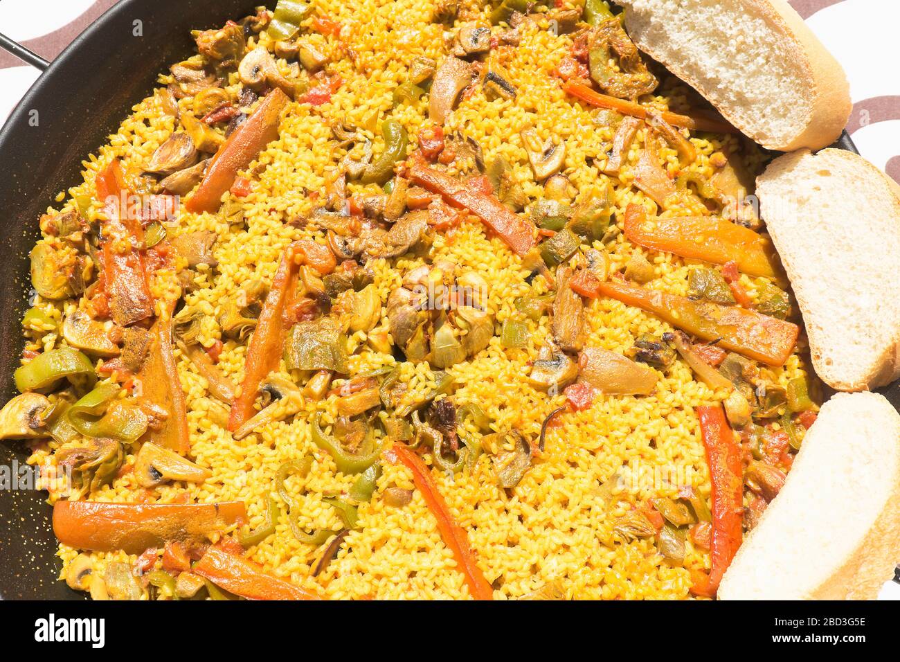 Vegetable paella made on fire with organic ingredients. Shot made in ...