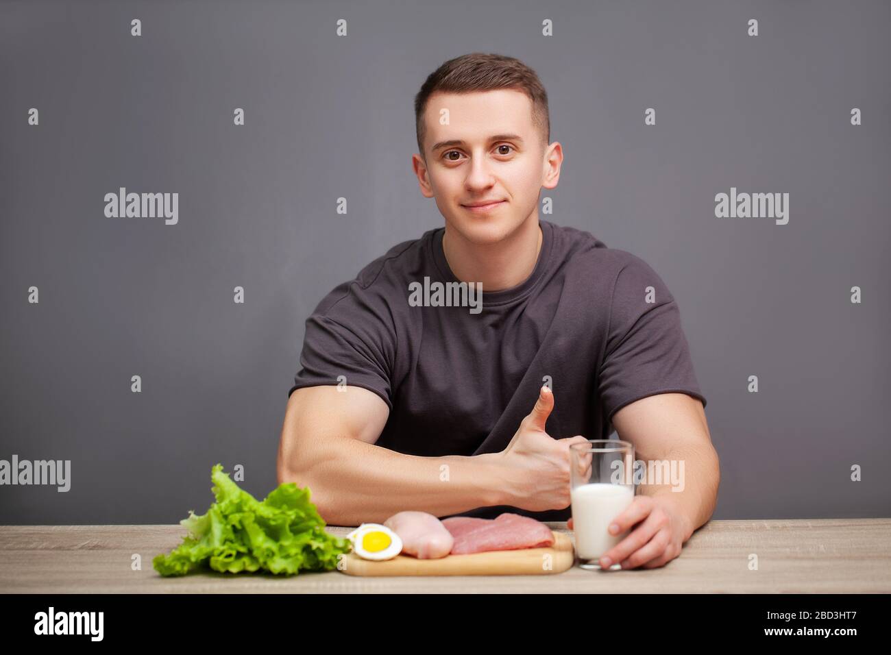Trainer consumes a high-protein meal of meat and fruit Stock Photo - Alamy