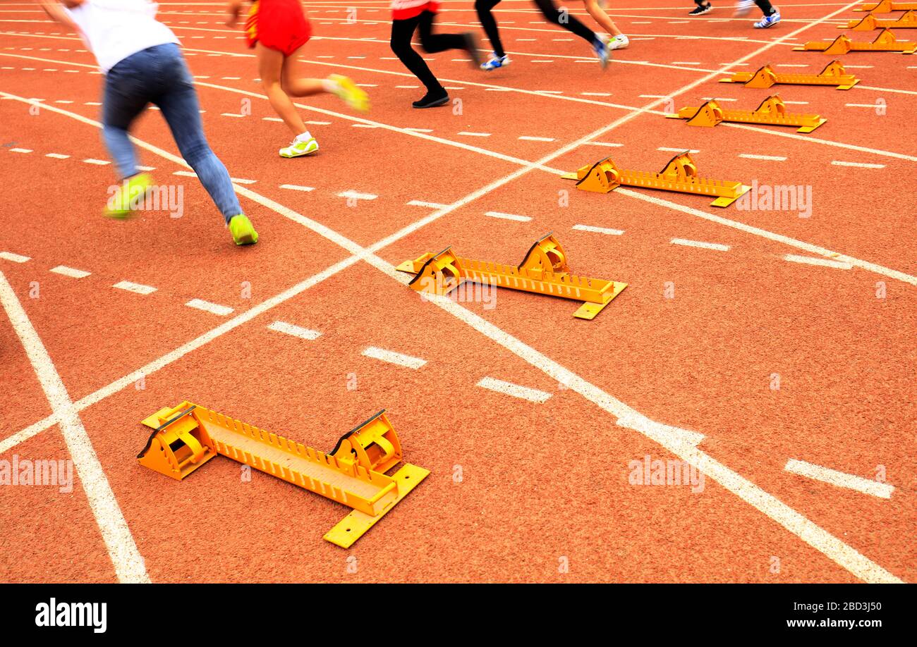 sprint start in track and field in blurred motion Stock Photo - Alamy