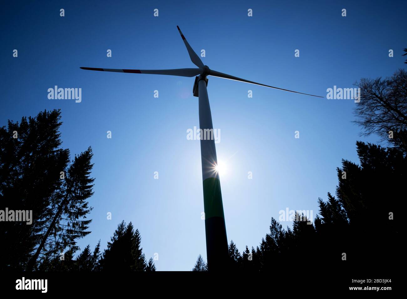 modern wind turbine in front of the evening sun Stock Photo - Alamy
