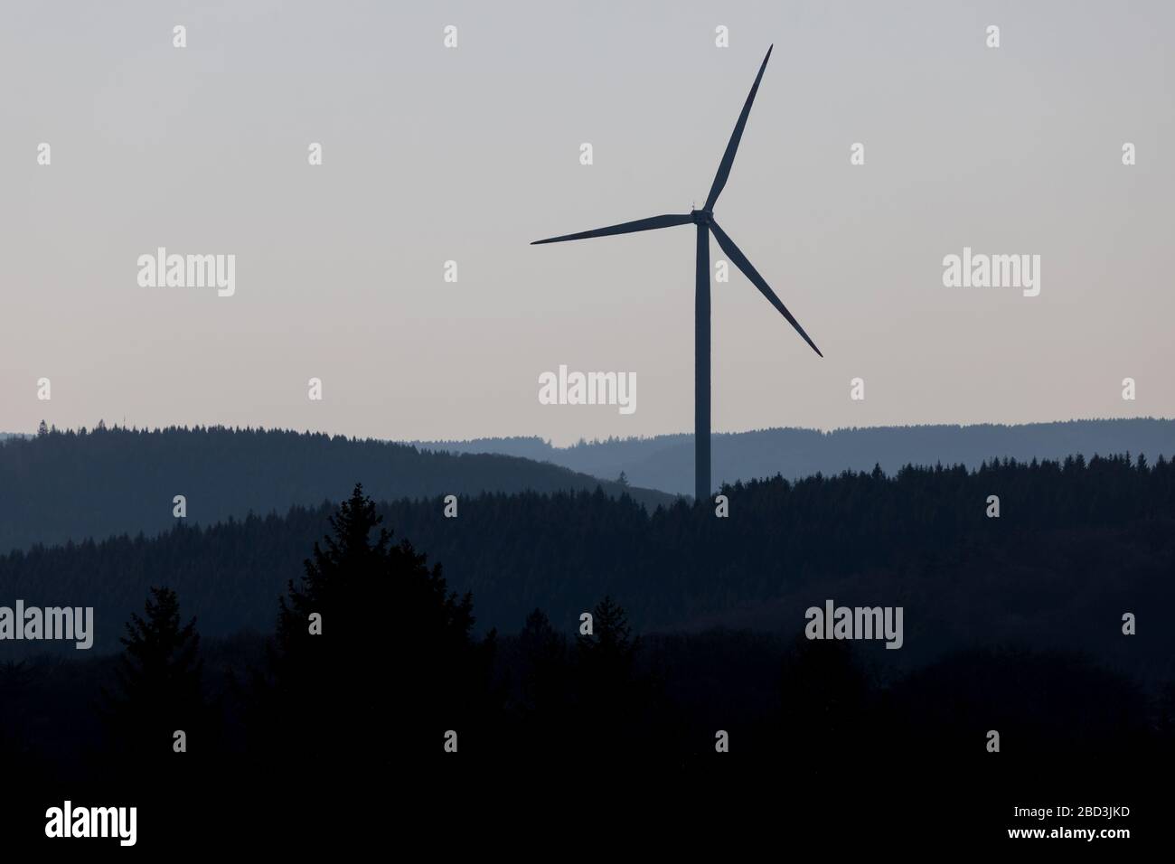 modern wind turbine in front of an evening landscape Stock Photo - Alamy