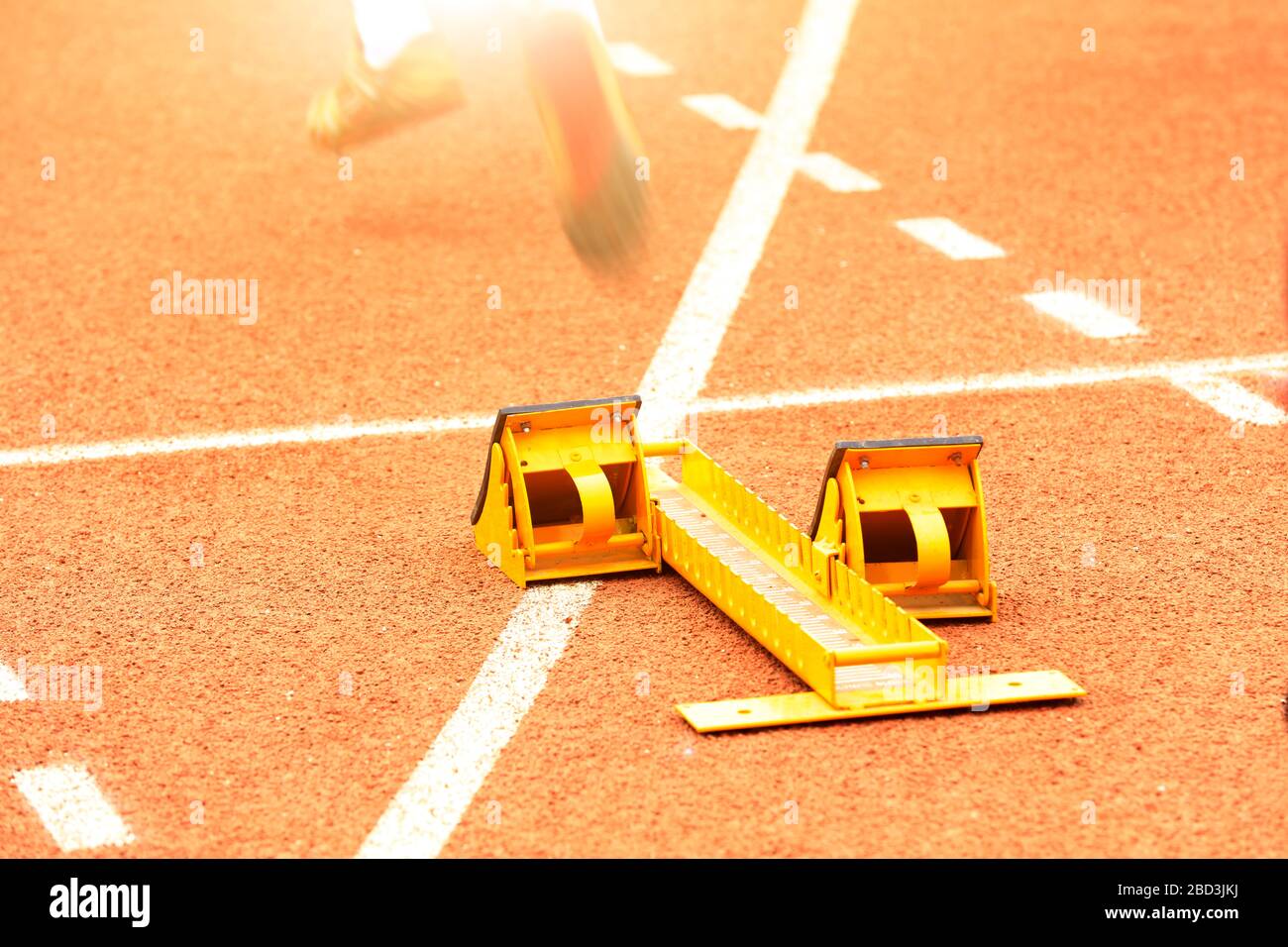 sprint start in track and field in blurred motion Stock Photo - Alamy
