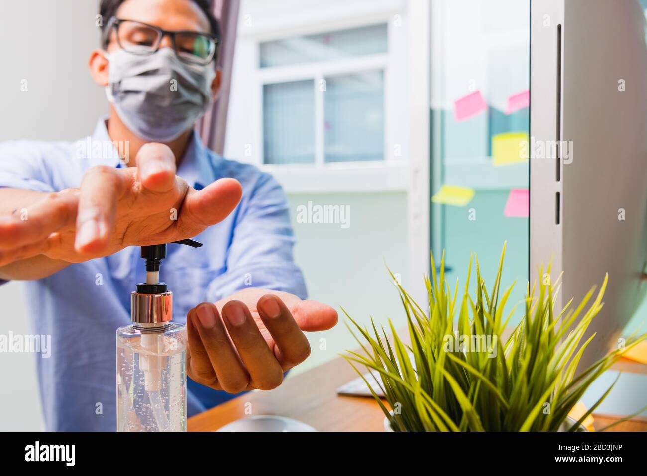 Asian Business young man working from home office he quarantines ...