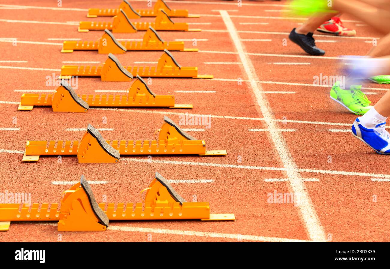 Athlete in motion sprinting hi-res stock photography and images - Alamy