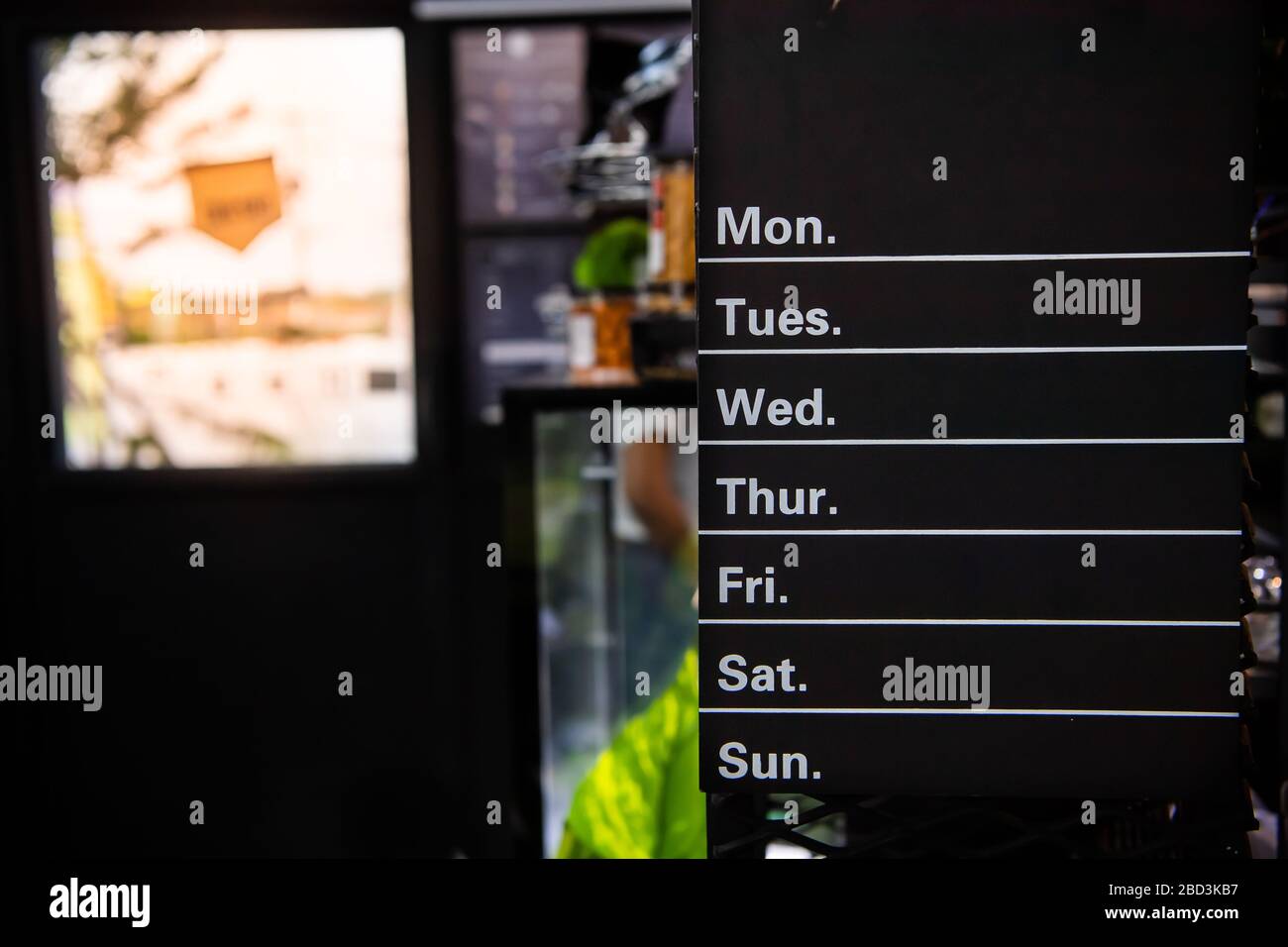 Wood black board for time schedule in office Stock Photo - Alamy