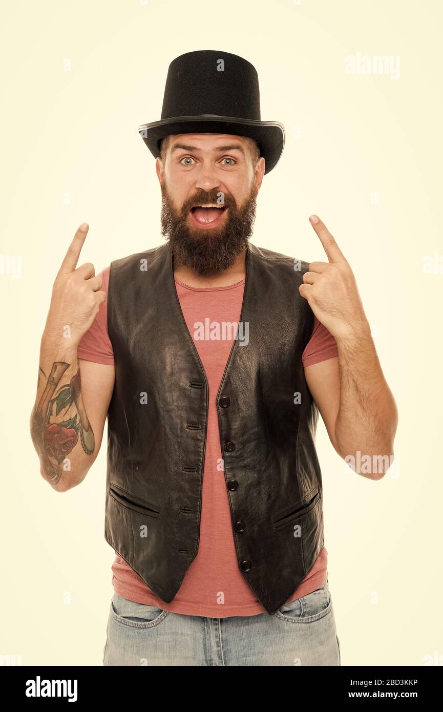 Old fashioned and vintage. Caucasian guy pointing at vintage top hat ...