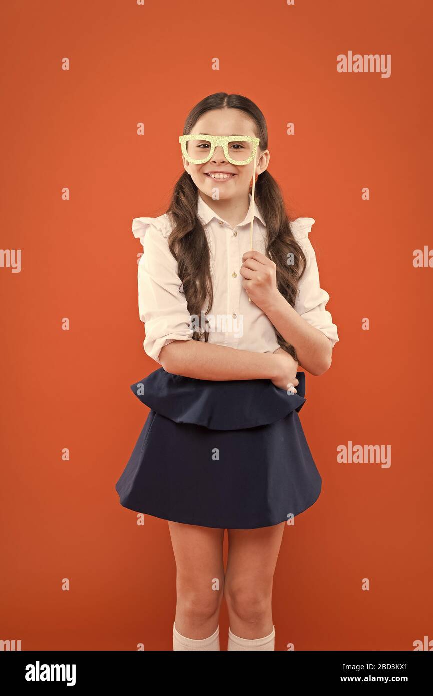 What does it mean being smart. Little smart schoolgirl on orange ...