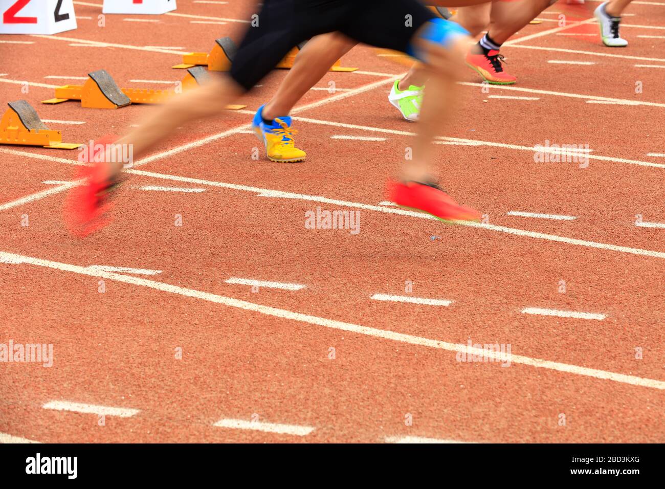 sprint start in track and field in blurred motion Stock Photo - Alamy