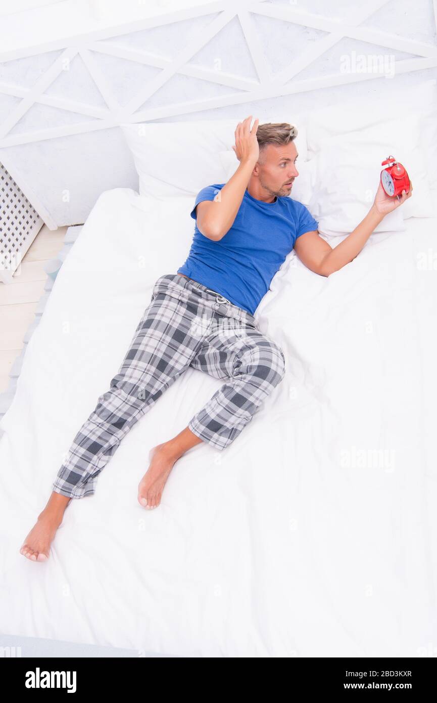 stop ringing. Lethargic male awake with alarm clock. early morning ...