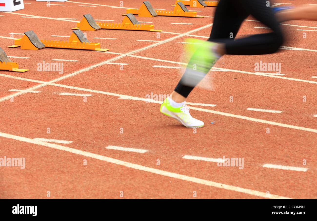 sprint start in track and field in blurred motion Stock Photo - Alamy