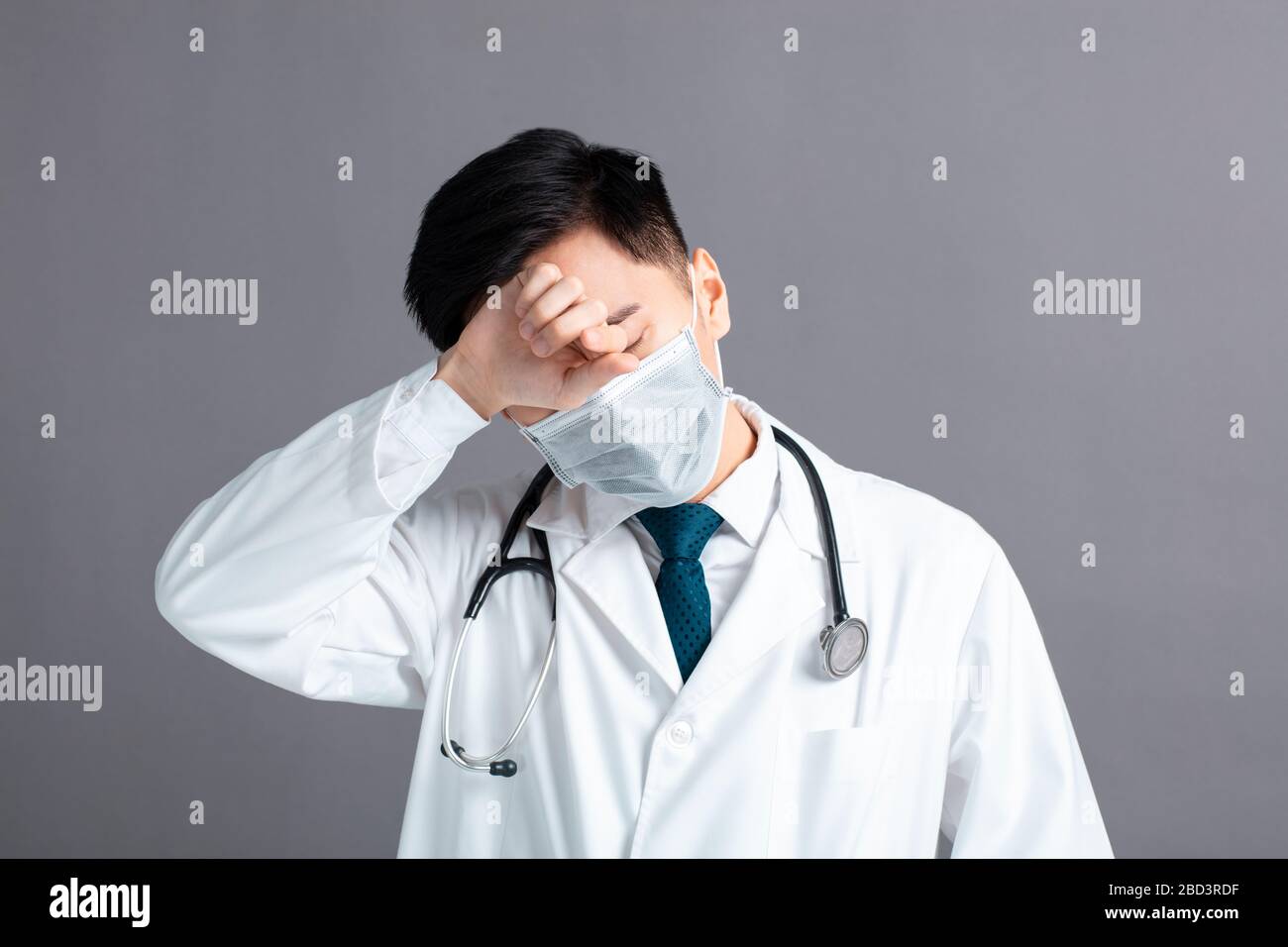 stress and tired young Doctor Wear Medical Mask Stock Photo - Alamy