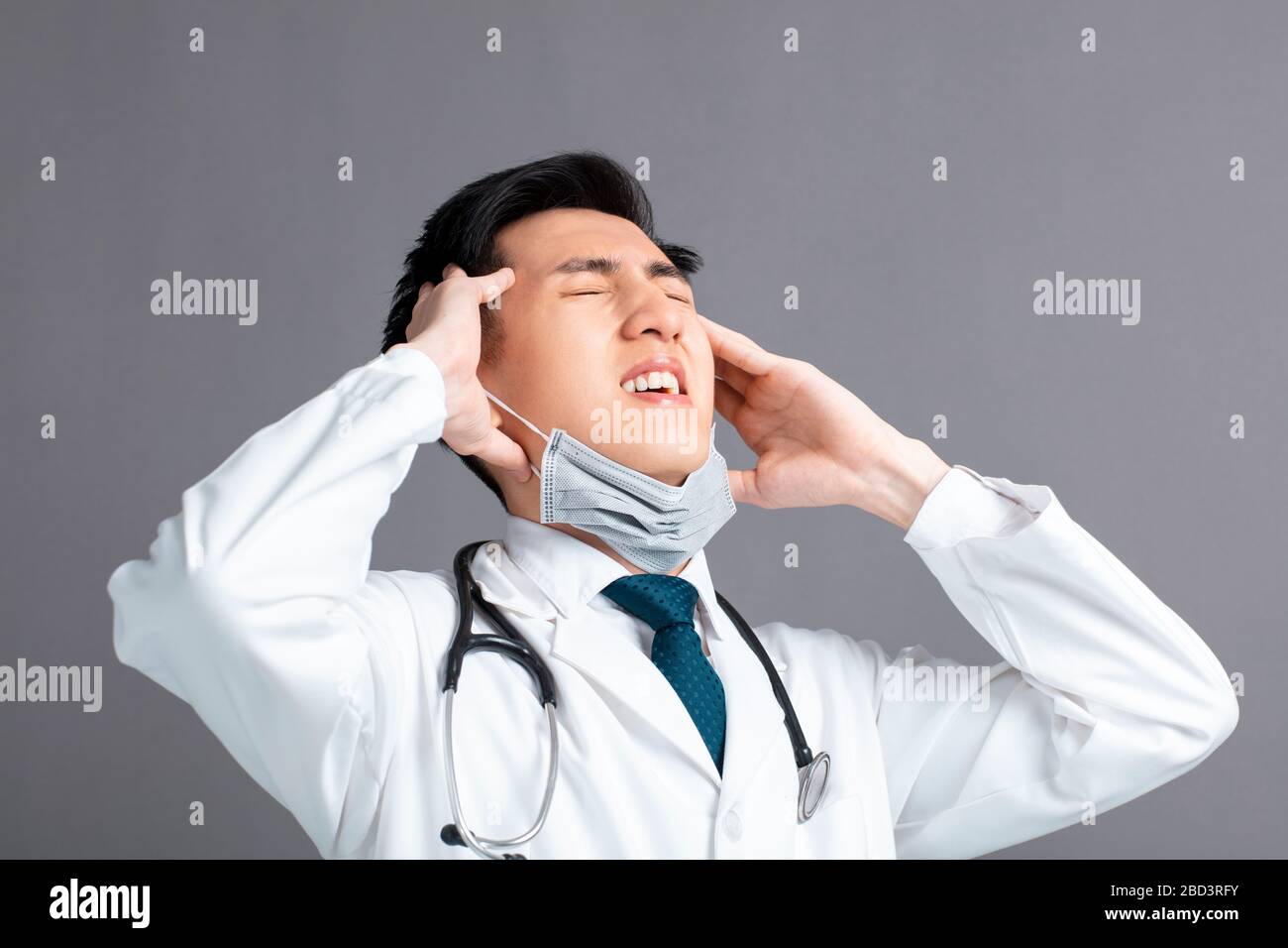 stress and tired young Doctor Wear Medical Mask Stock Photo - Alamy