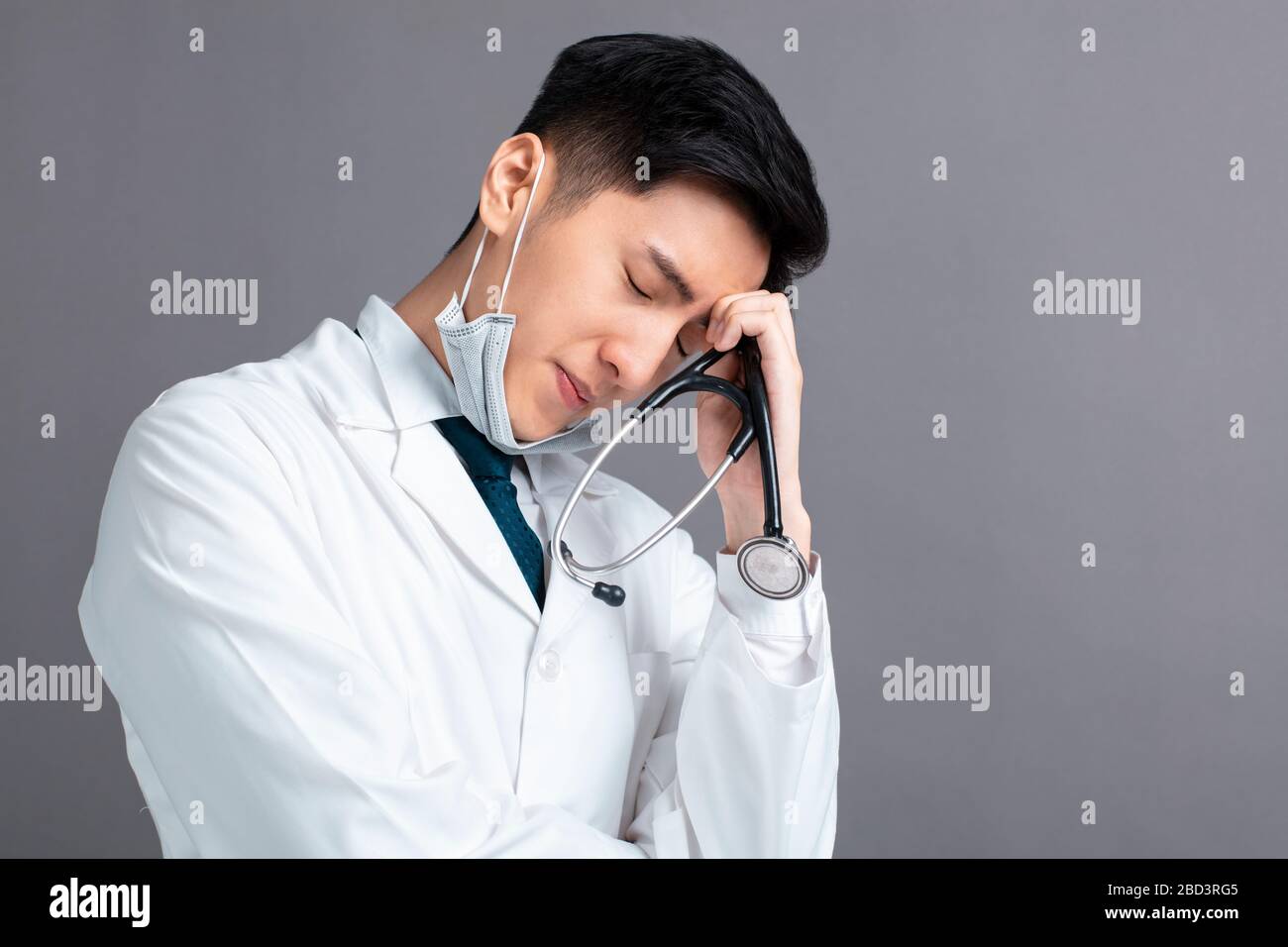 stress and tired young Doctor Wear Medical Mask Stock Photo - Alamy