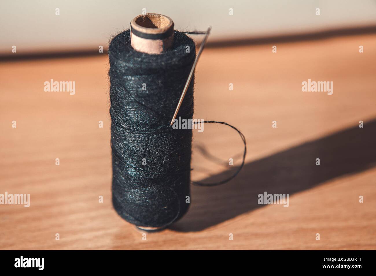 coil with black thread for sewing Stock Photo - Alamy