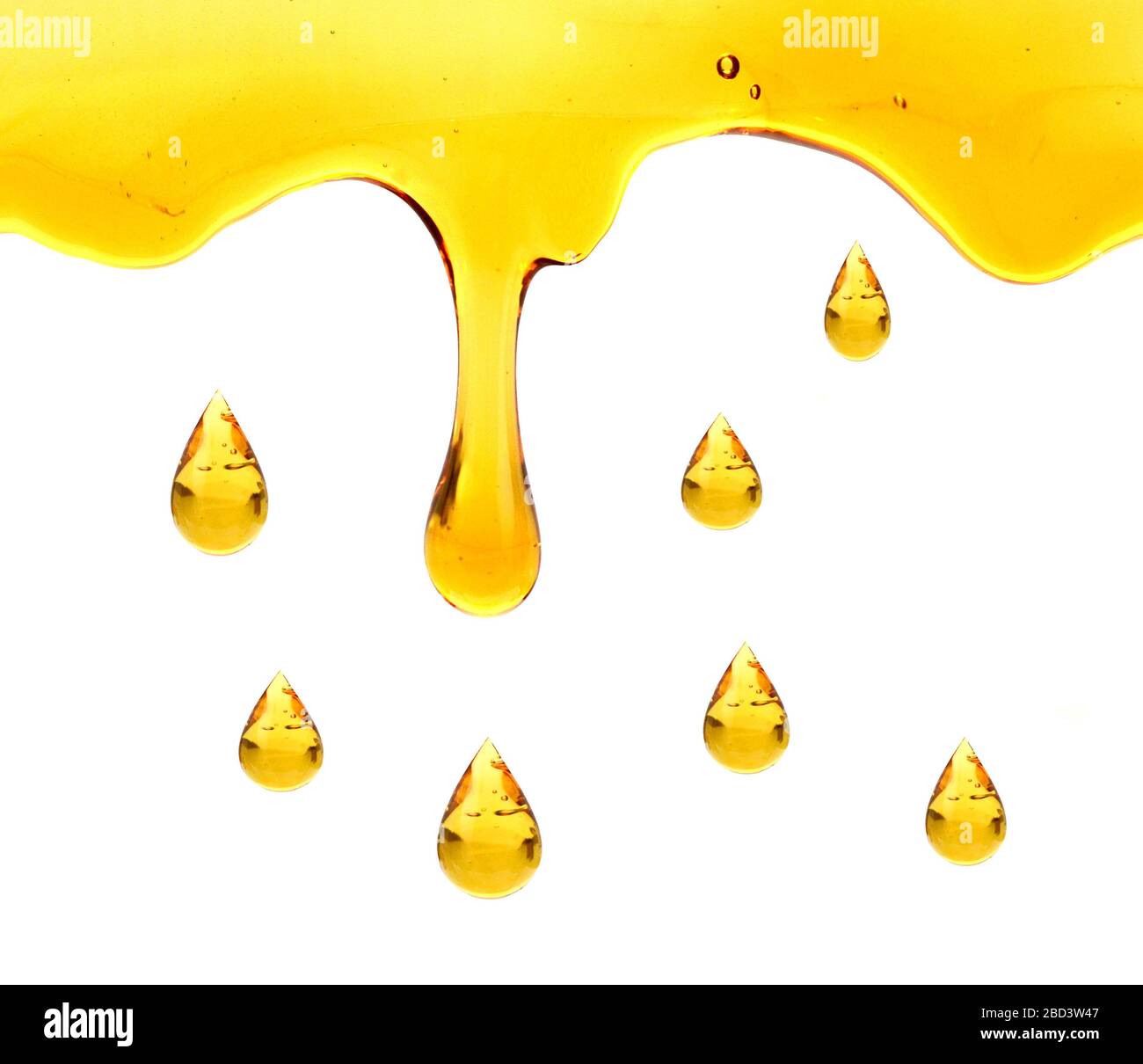 Closeup honey dripping isolated on white background Stock Photo - Alamy