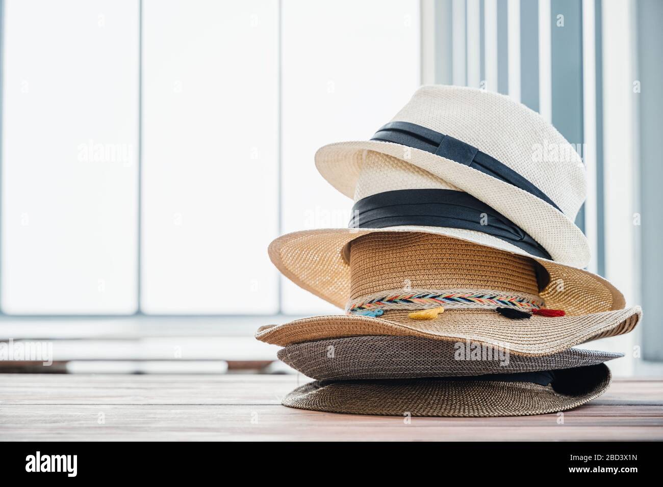 Stacked of hat on table in room with free space. Travel background ...