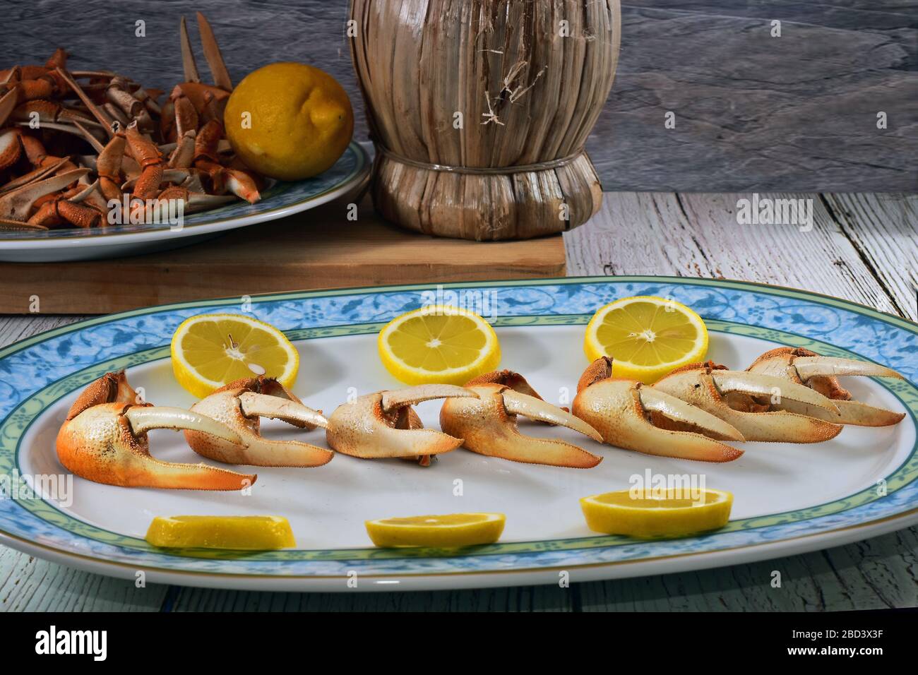 Cooked fiddler crab claws and lemon wedges. Typical Andalusian dish ...