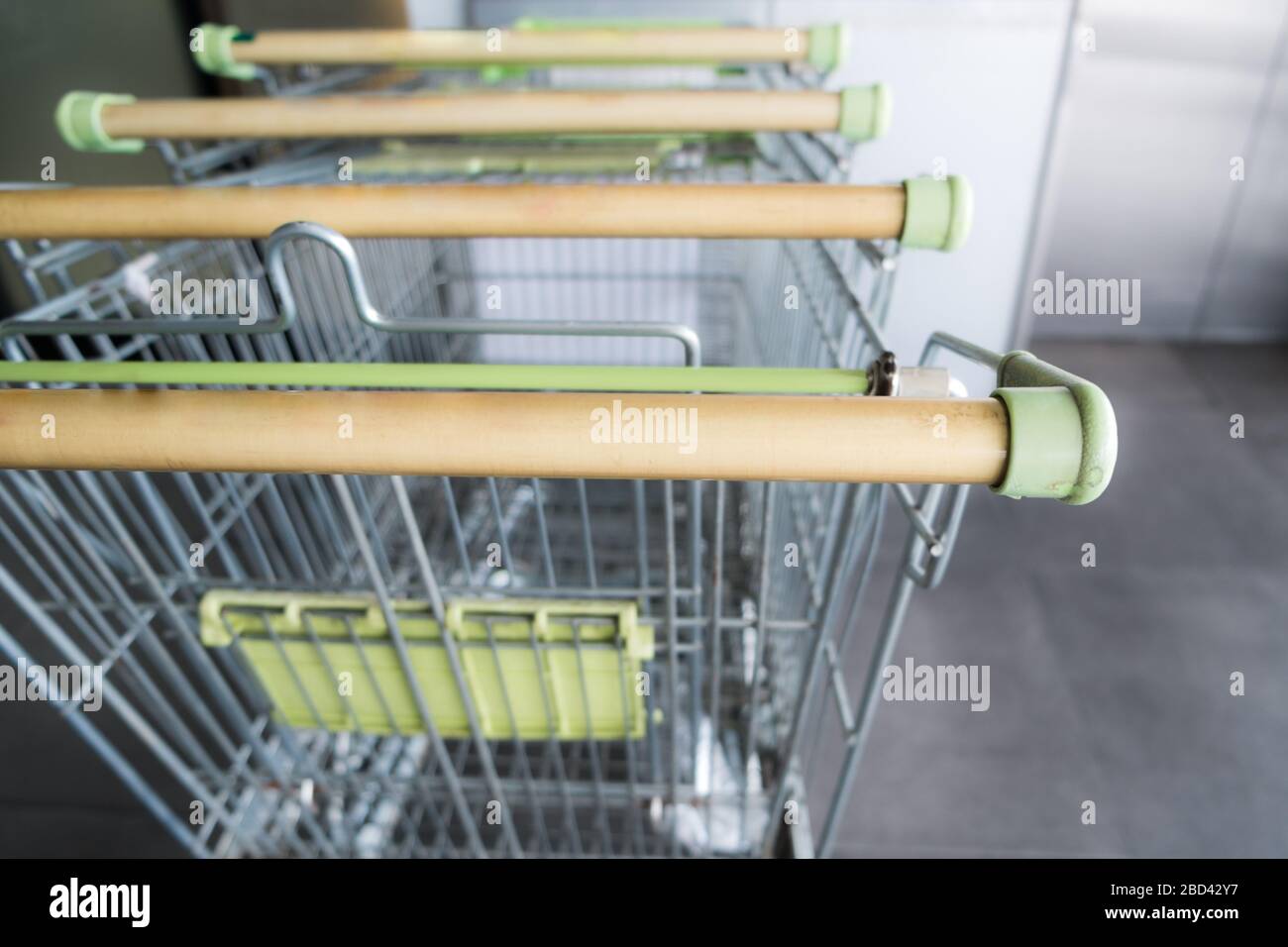Empty shopping cart with dirty cart handle during coronavirus outbreak ...