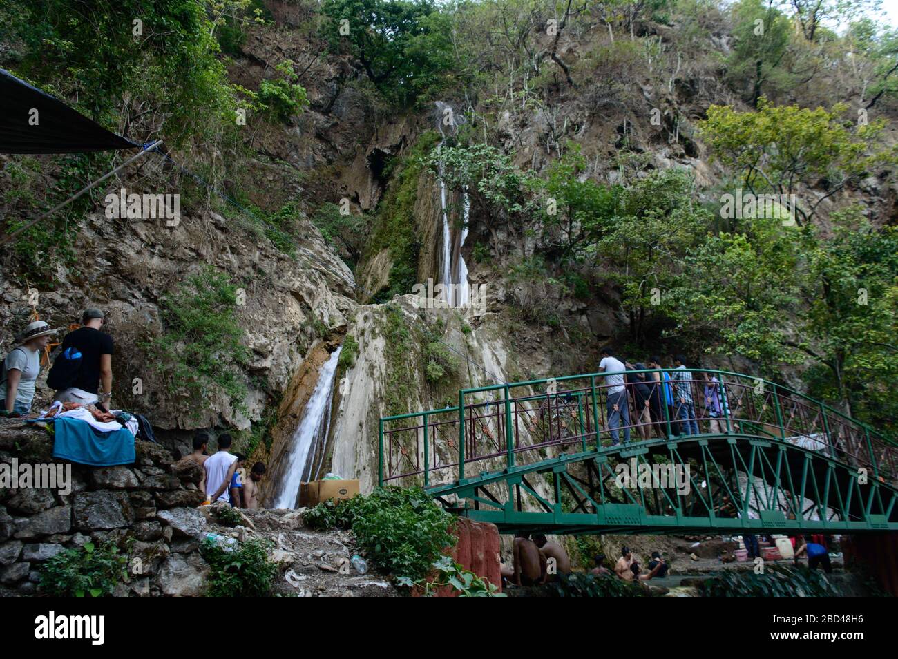 Group of people enjoying under the famous neer garh Waterfall ...