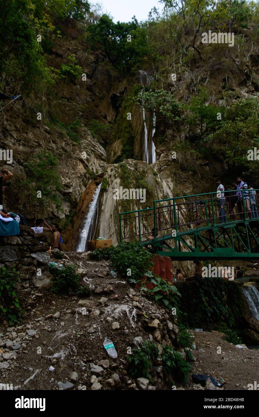 Group of people enjoying under the famous neer garh Waterfall ...