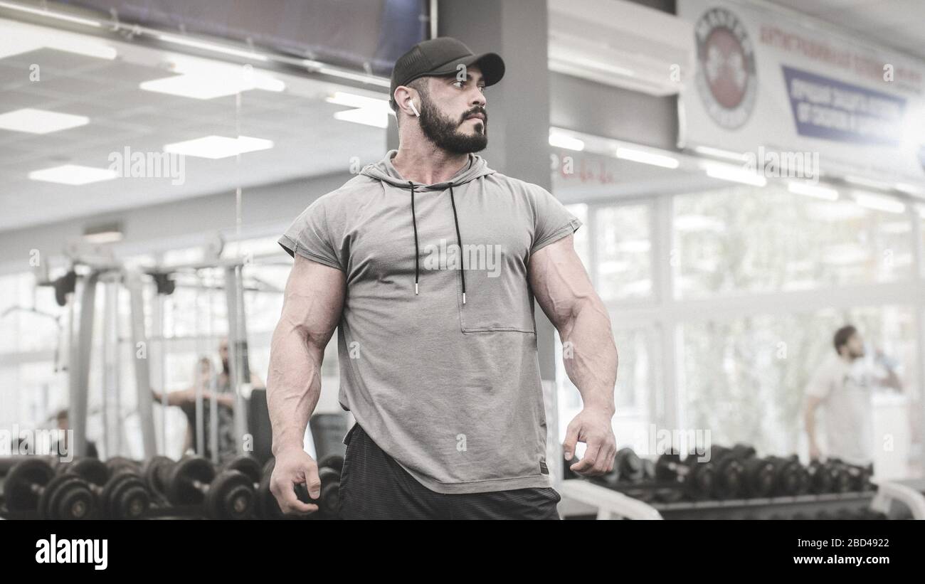 epic strong super hero man with huge muscle in sport gym Stock Photo ...