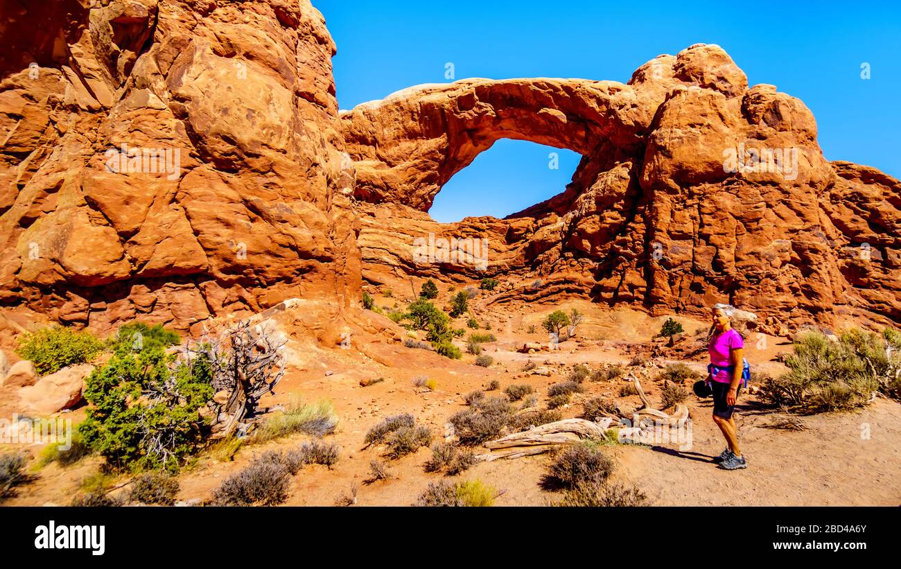 Woman on a Hiking Trail to the South Window Arch in the Windows Section ...