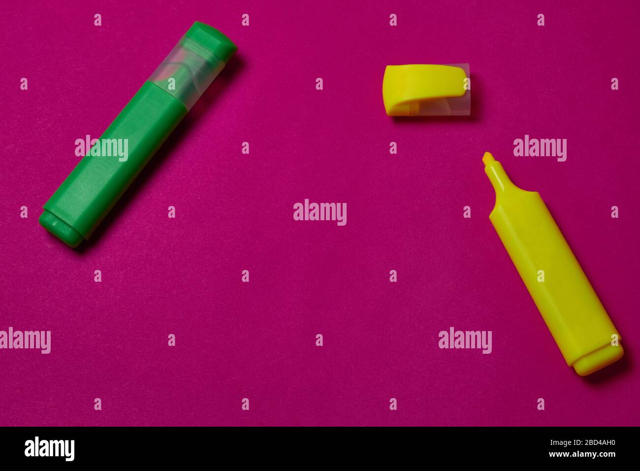 Multi colored highlighters at magenta background with copy space Stock ...