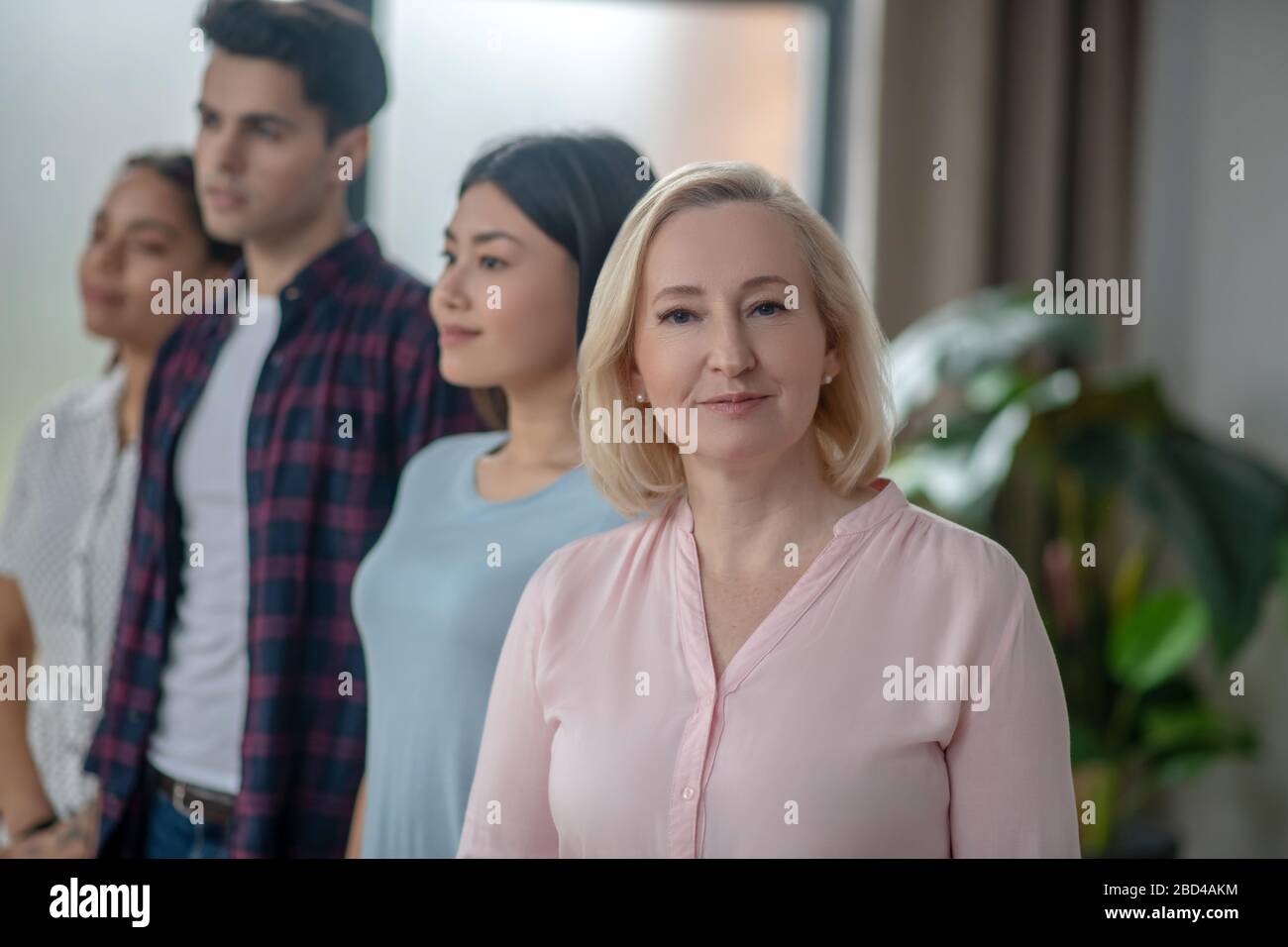 Multi-ethnical group of people standing close to each other Stock Photo ...