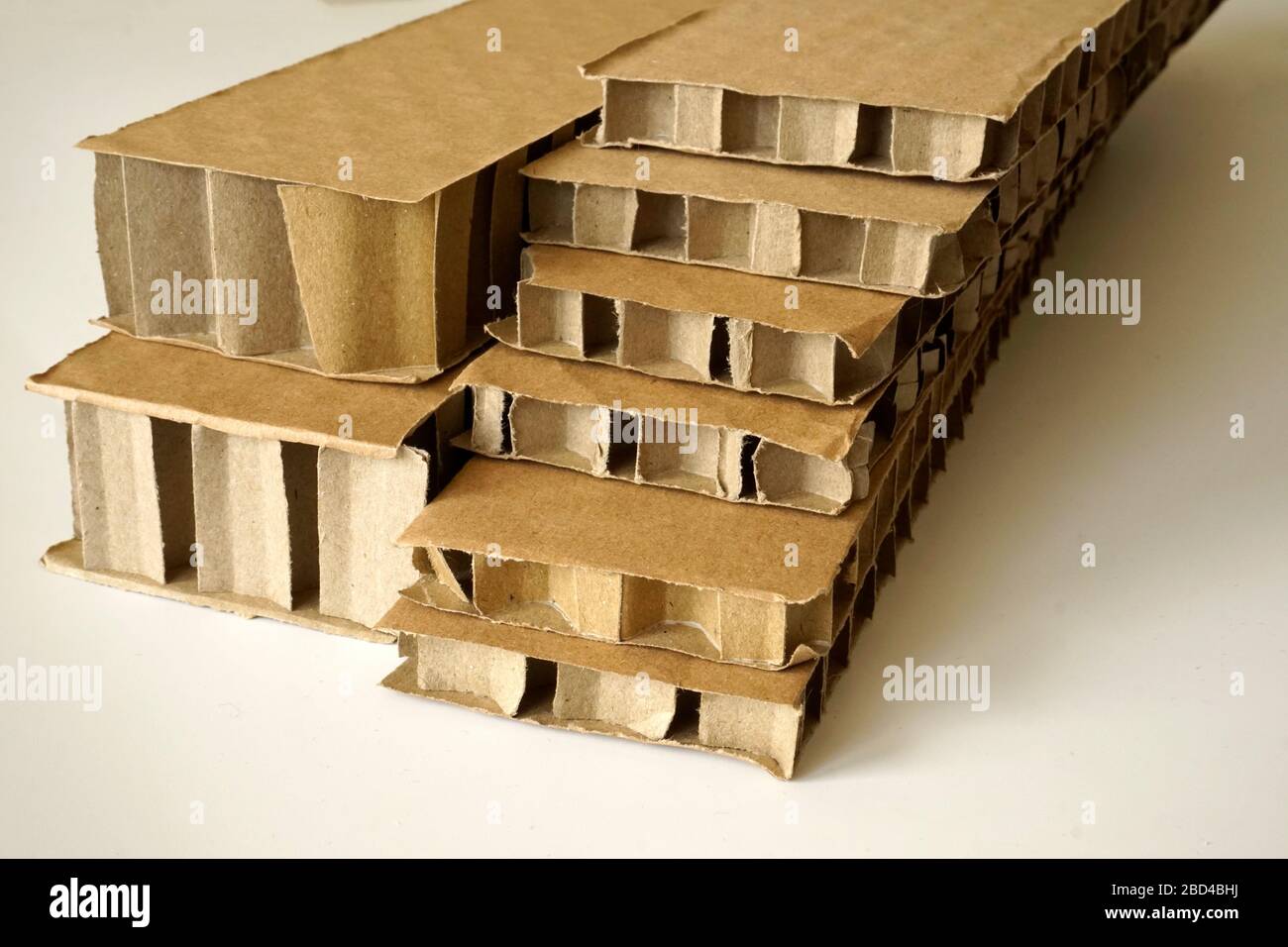 Sheets of brown corrugated cardboard used for filling in fragile parcels. Rigid double wall ...