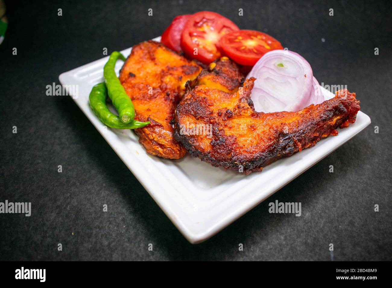 Fried Fish Pieces With Salad on Black Background Stock Photograph Image ...