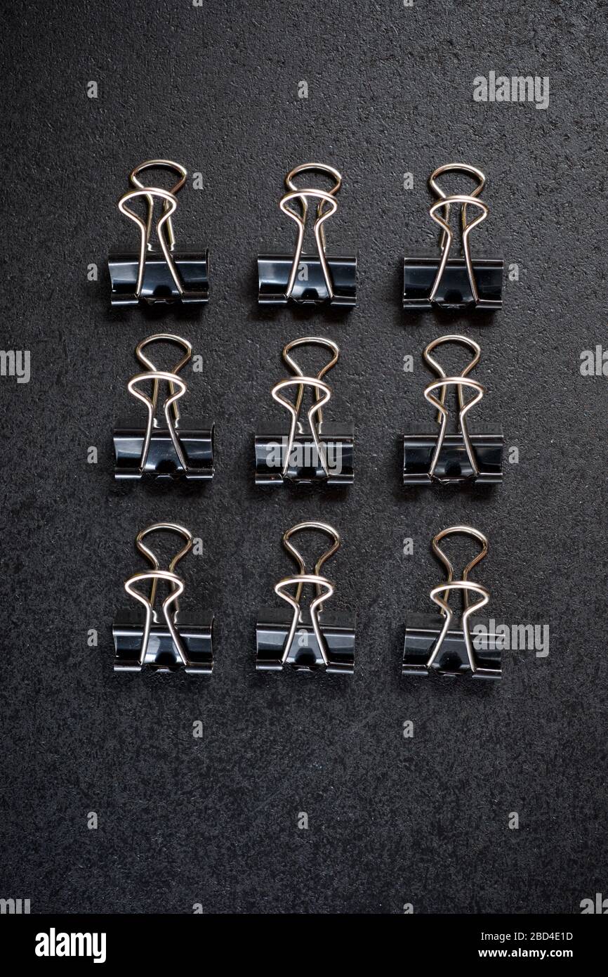 Clamps on a black table Stock Photo - Alamy