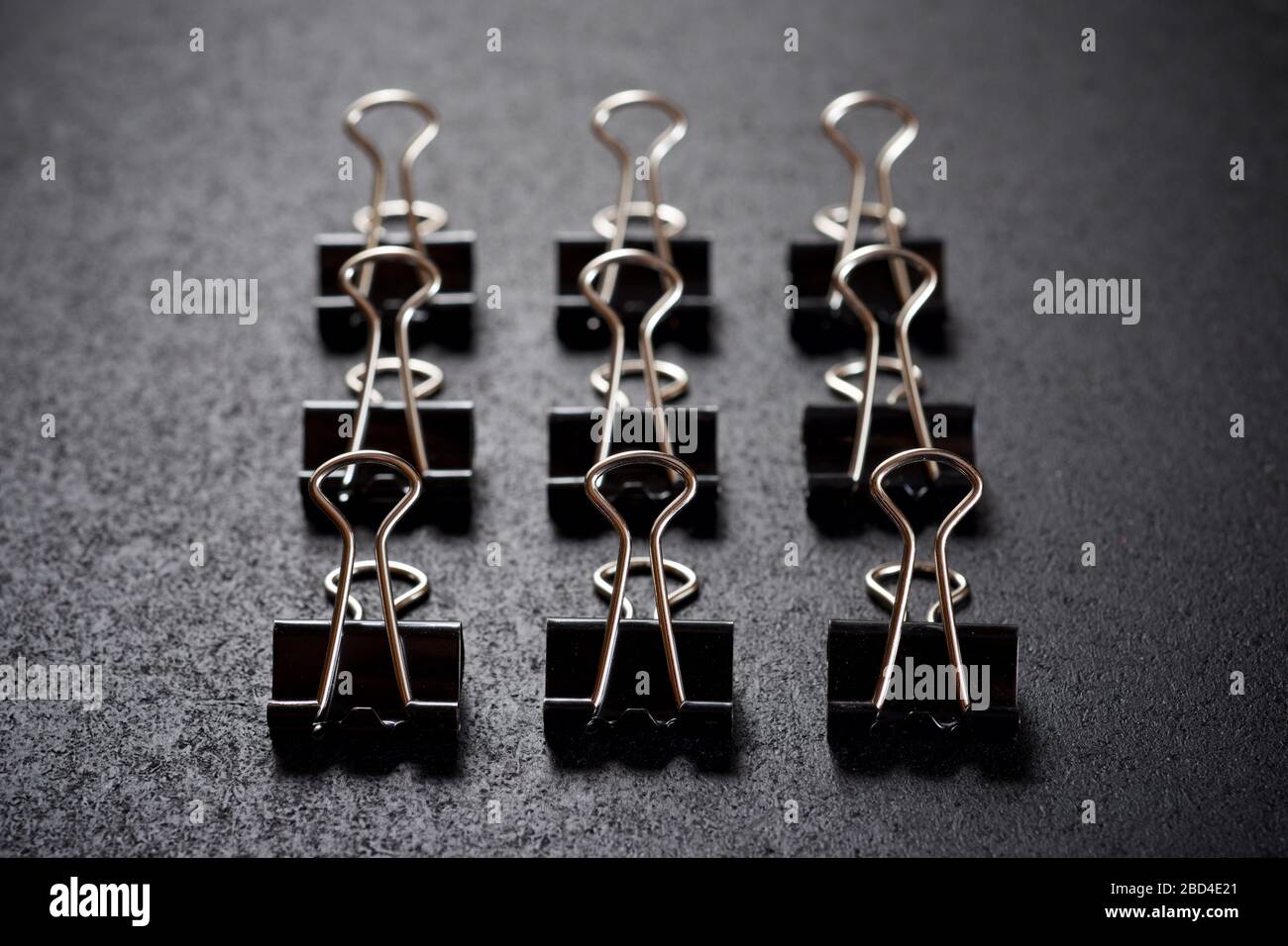 Clamps on a black table Stock Photo - Alamy