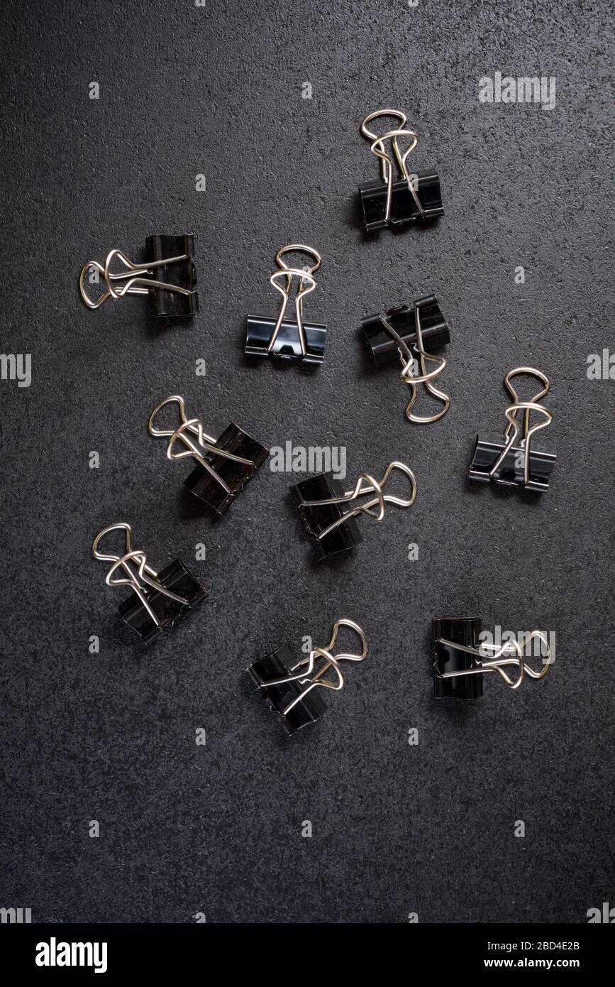 Clamps on a black table Stock Photo - Alamy