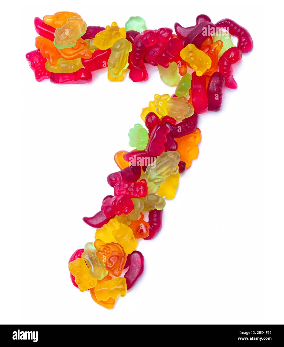Arabic numeral "7" from multi-colored marmalade on a white isolated ...