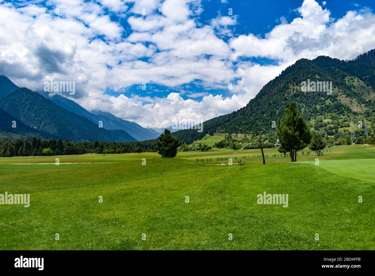 Beautiful lush green Golf Course surrounded by beautiful mountainous at ...