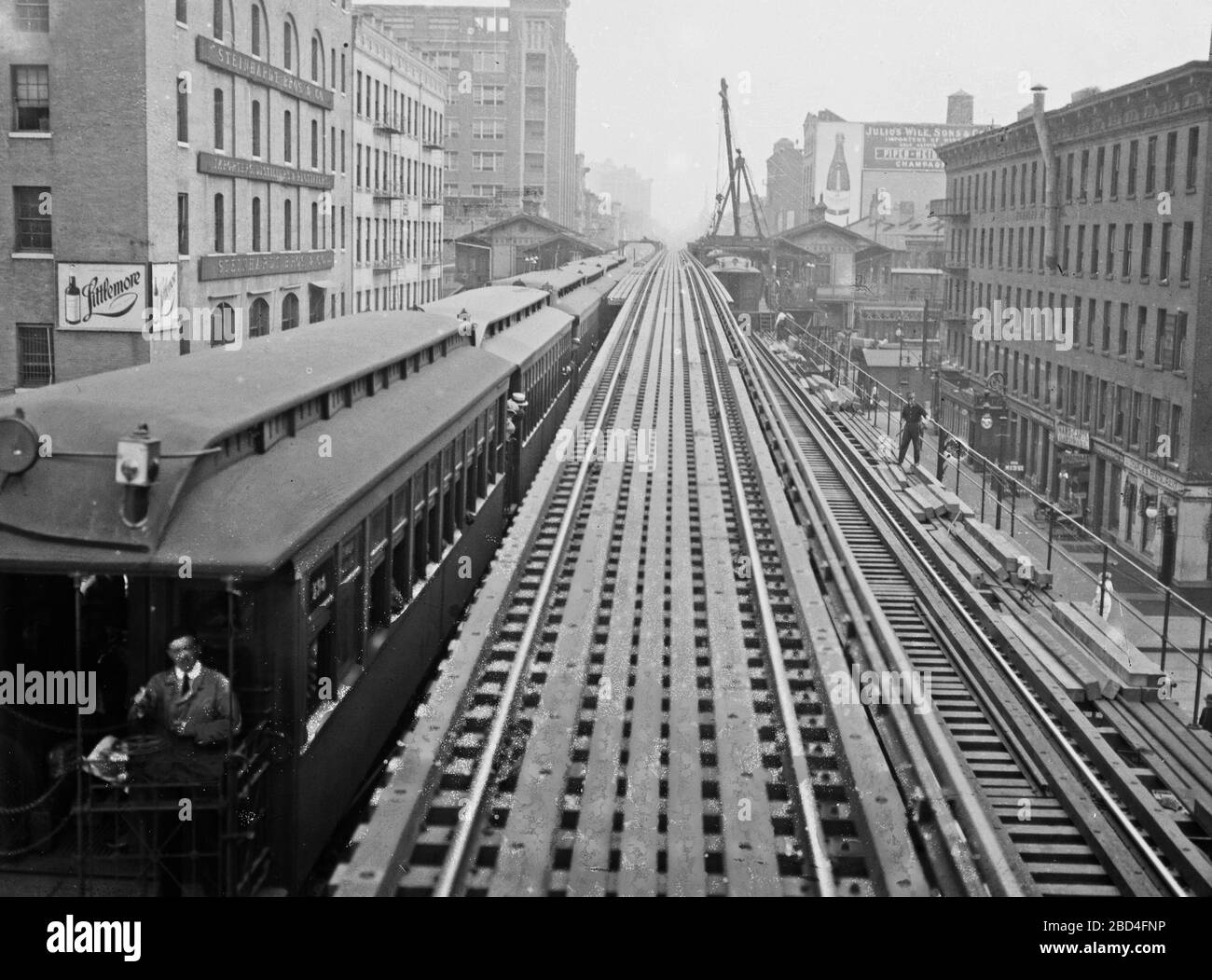 Express tracks of the Ninth Avenue El (elevated railroad) with a train ...