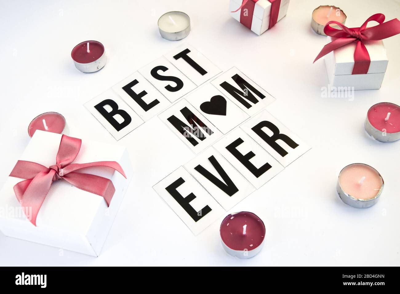 BEST MOM EVER text on white table background, with gift boxes and ...