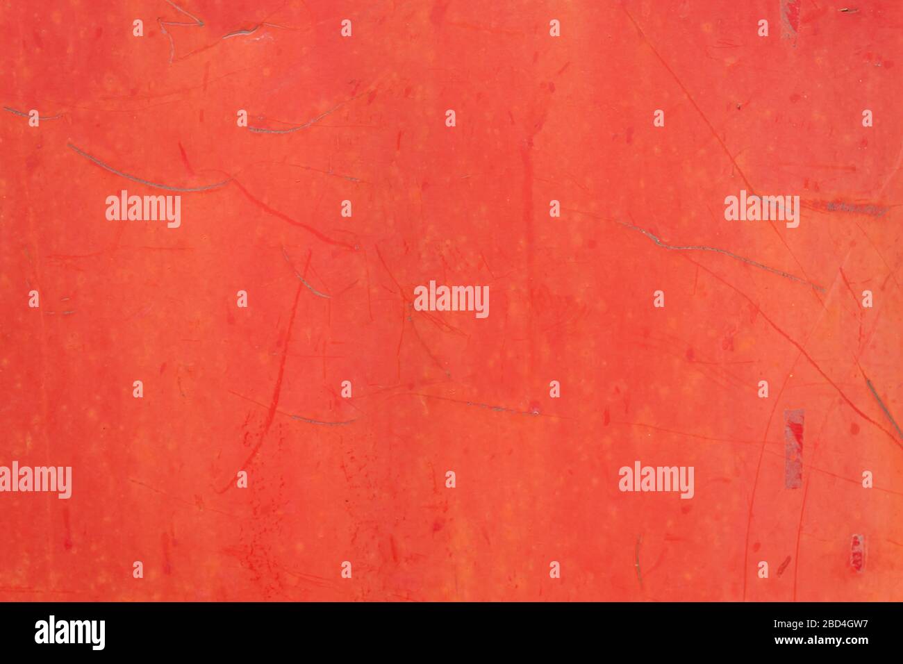 Red Painted Concrete Wall With Scratches Stock Photo - Alamy