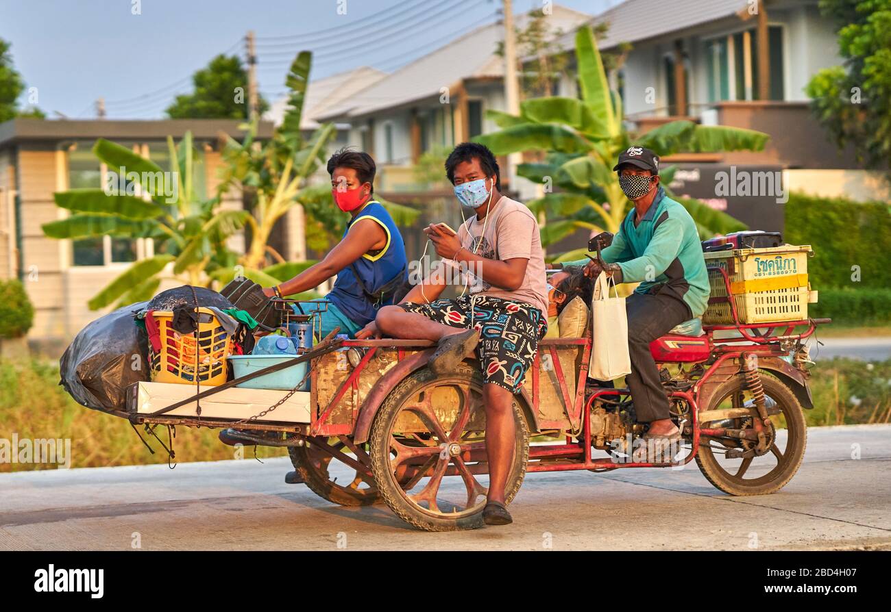 A man on a motorcycle wearing a face mask Stock Photo - Alamy
