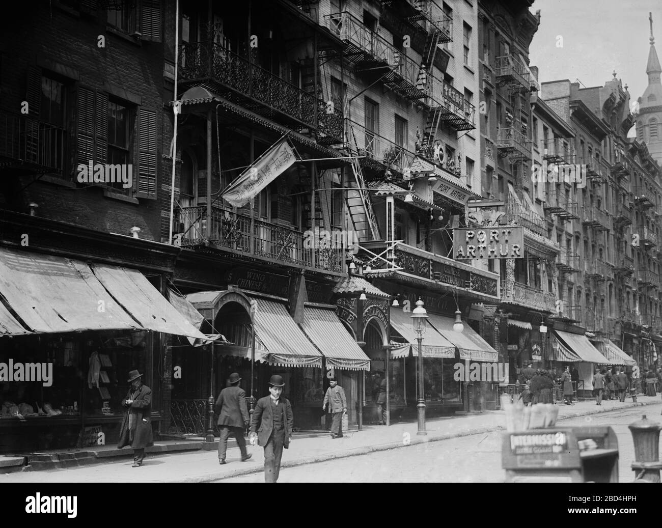 Mott Street in Chinatown, New York City. Church of the Transfiguration ...
