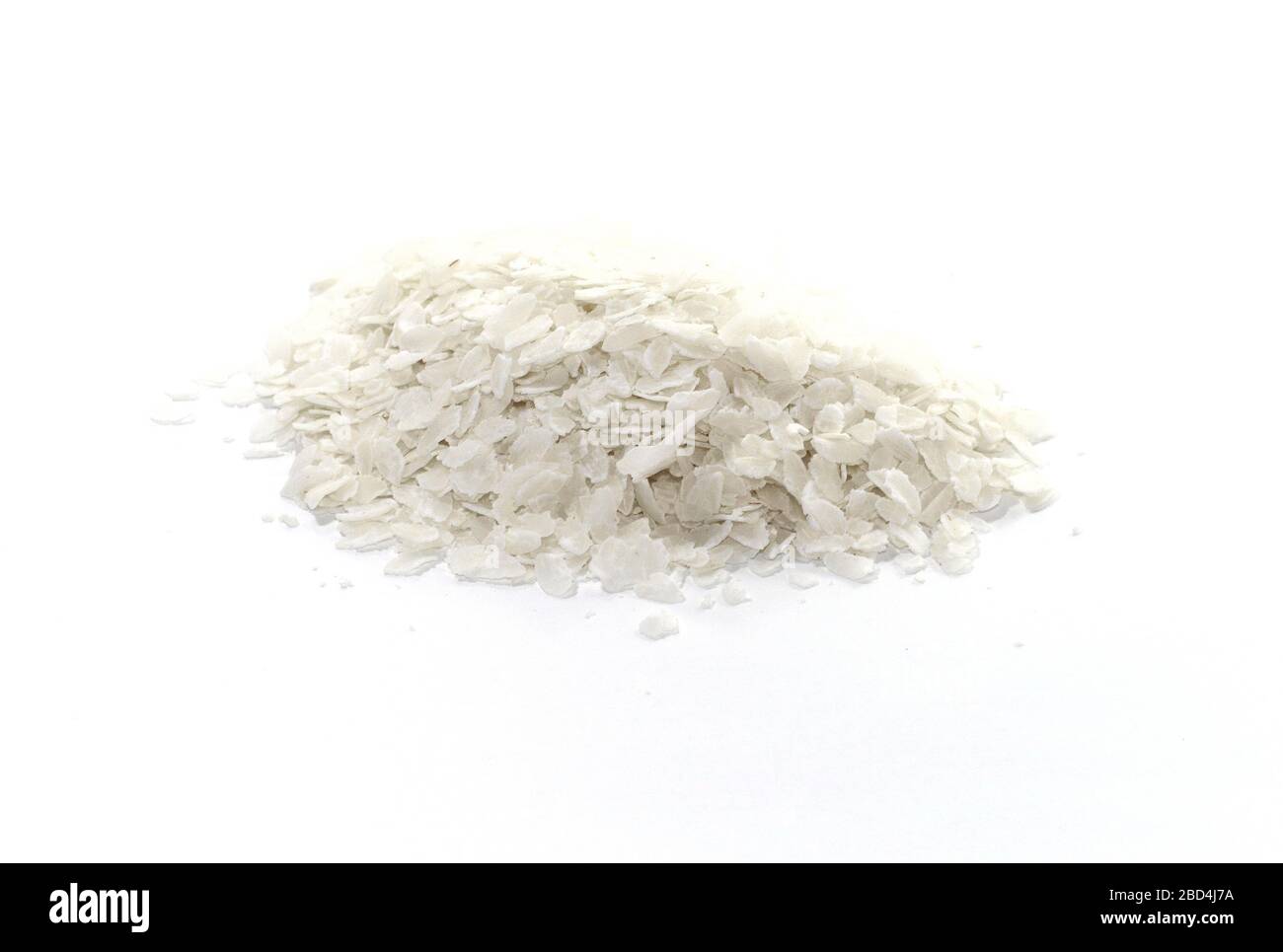 flattened rice flakes isolated on white Stock Photo - Alamy