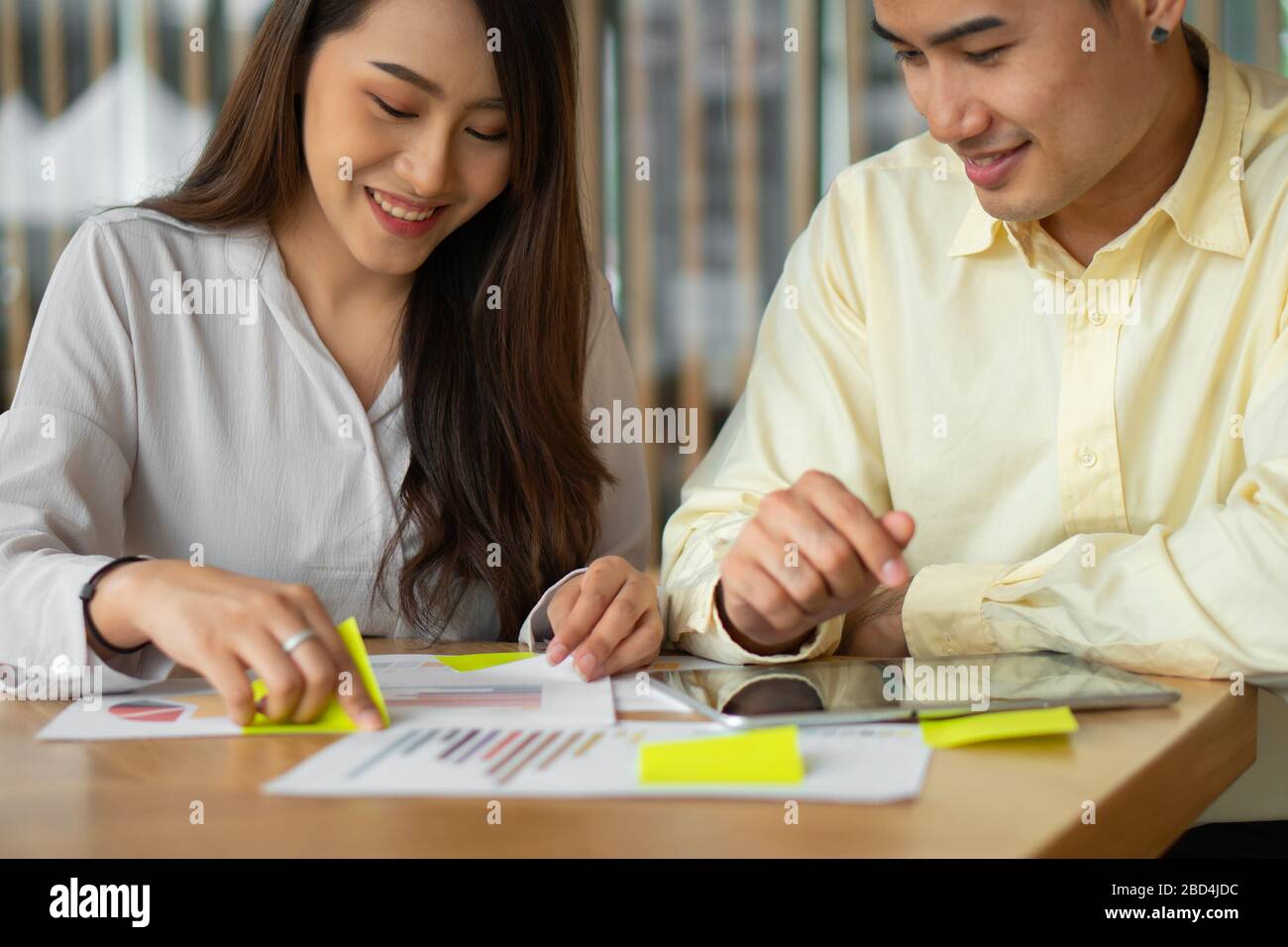 Happy Asian couples be smile after calculating income And expenses ...