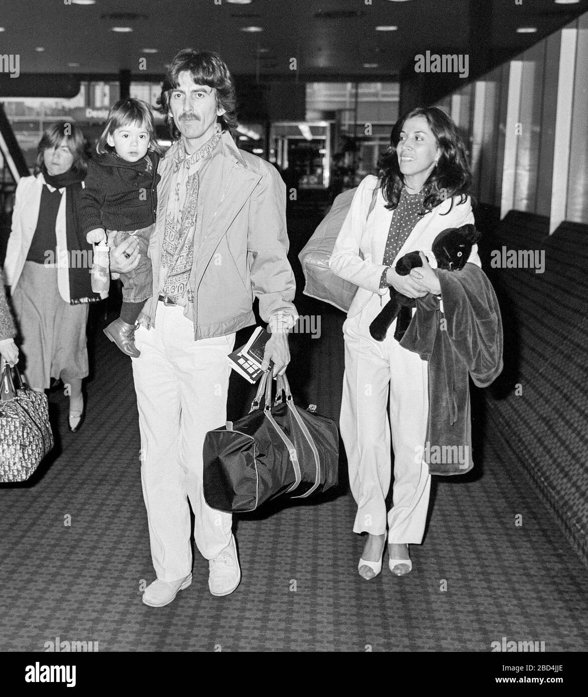 George Harrison with wife Olivia and son Dhani arriving at London's ...