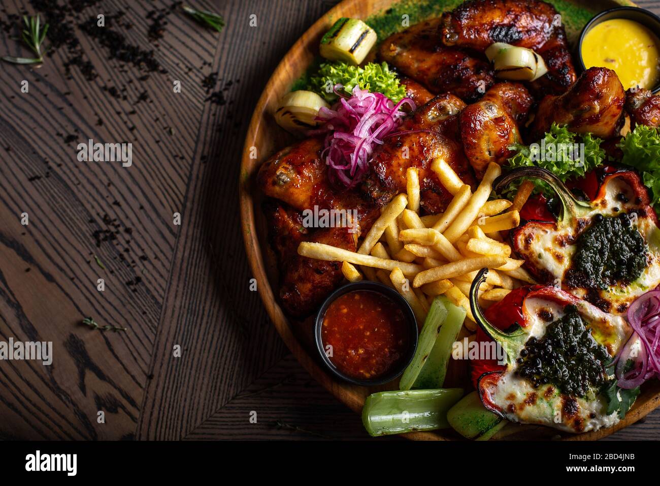 Fried chicken wings and French fries. Menu Stock Photo - Alamy